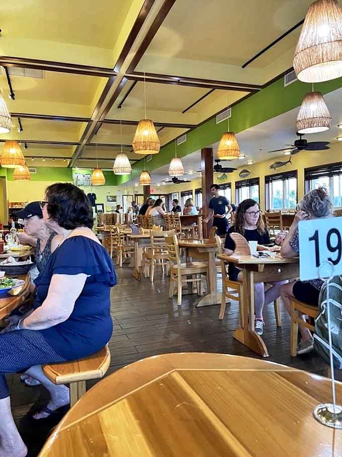 The true measure of a local gem: a dining room where flip-flops meet foodie enthusiasm. Table 19 is having the time of their lives.