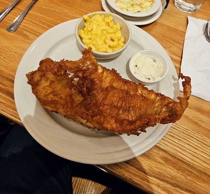This isn't just fried fish&mdash;it's golden-battered happiness with mac and cheese that tastes like childhood memories, only better.