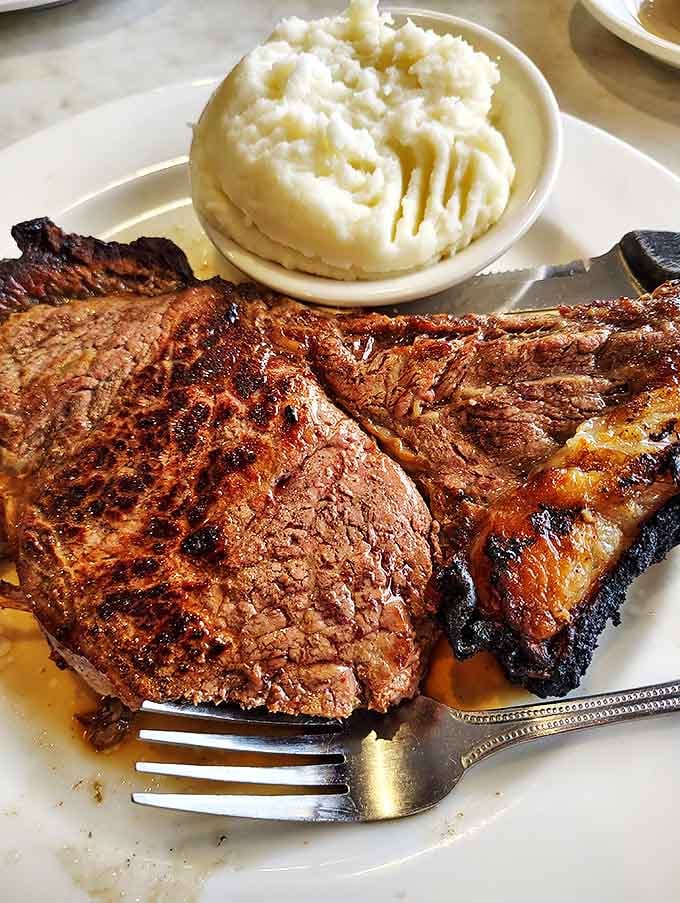 A steak that's seen the perfect amount of fire, paired with mashed potatoes that could make a carb-counter reconsider their life choices.