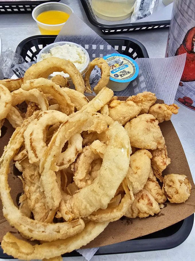 Crispy halos of onion rings alongside golden-fried scallops&mdash;proof that sometimes the best things in life come in paper baskets.