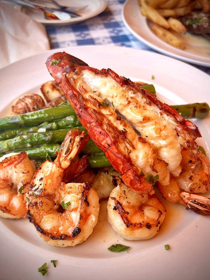 Surf meets turf's sophisticated cousin. These perfectly seared scallops and lobster tail are having a garden party with those vibrant green beans.