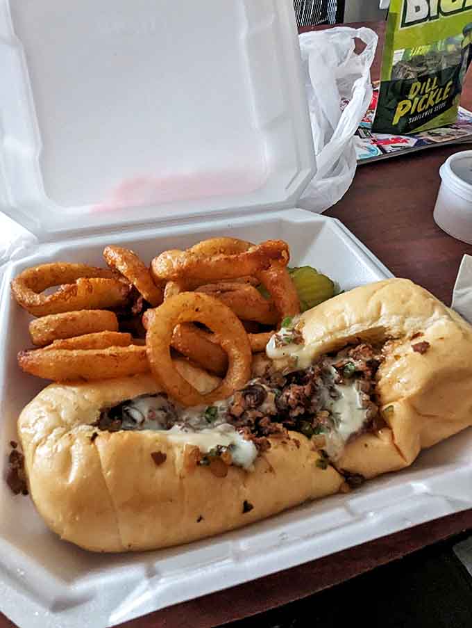 This Philly sandwich with onion rings isn't just lunch &ndash; it's an edible work of art that demands to be appreciated before devouring.