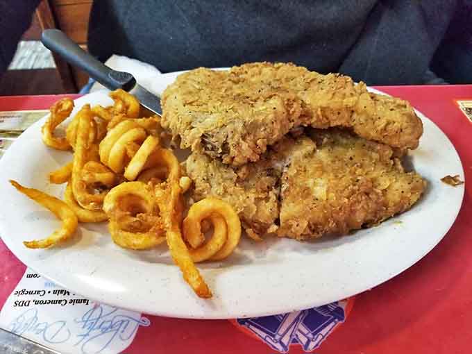 Golden-fried pork chops with all the fixings&mdash;proof that sometimes the simplest pleasures are the most satisfying.