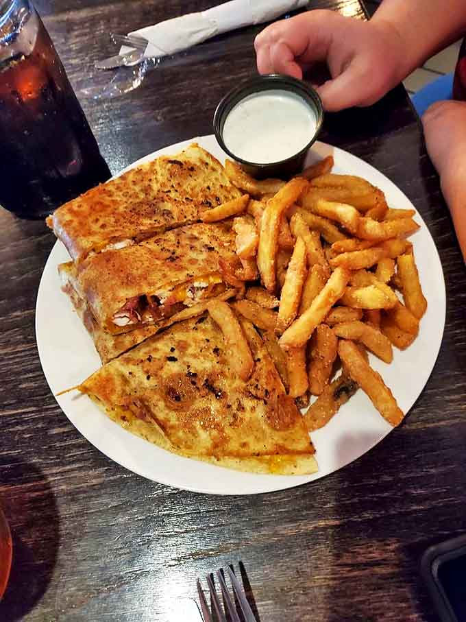 A quesadilla that's achieved the perfect golden-brown exterior, with crispy edges that make that satisfying crunch when you bite in.