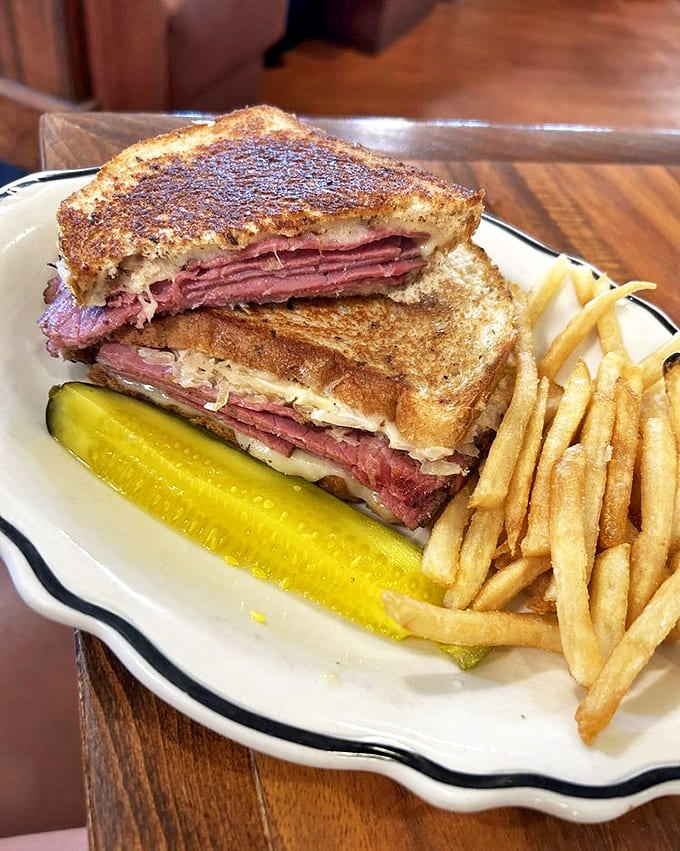 A proper Reuben should require both hands and make you forget your manners. This beauty checks all the boxes.