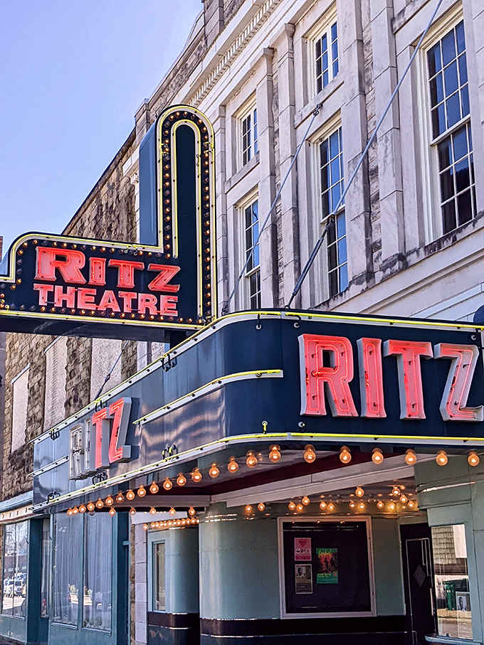 The historic Ritz Theatre's neon marquee glows with vintage charm, promising entertainment that has brought the community together for generations.