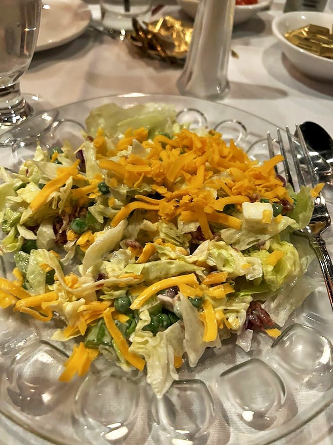 The seven-layer salad isn't just a side&mdash;it's architectural genius disguised as vegetables, with each layer playing its perfect role.