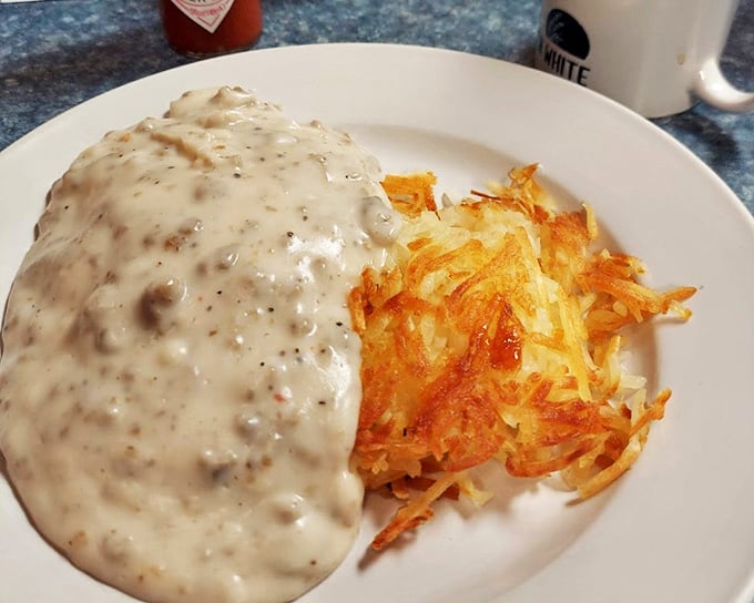 Country gravy with crispy hashbrowns &ndash; a plate that says "good morning" with more sincerity than any barista ever could.