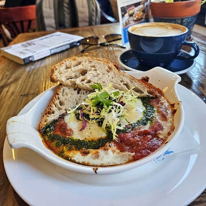 Eggs baked in spiced tomato sauce with a side of crusty bread&mdash;breakfast that's ready for its passport and international adventure.