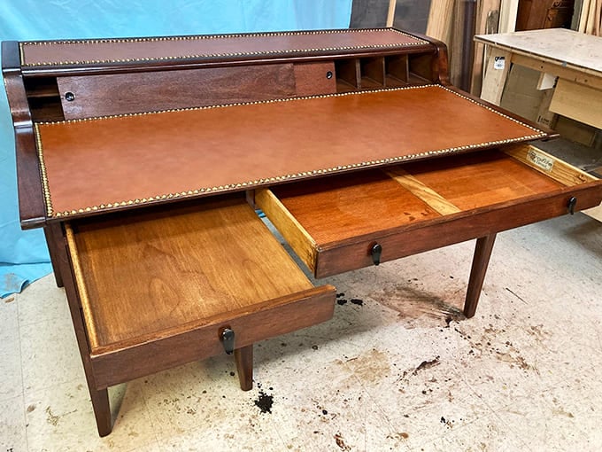 Before laptops and smartphones, this roll-top desk was command central for correspondence. Those drawers probably held more secrets than your password manager.