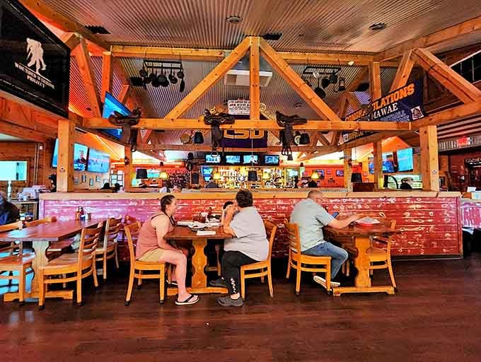 Rustic wooden beams and LSU memorabilia create the perfect backdrop for that most sacred of Louisiana rituals: the perfectly cooked steak.
