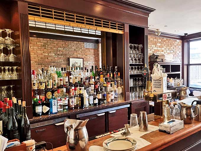 Behind this bar, bottles stand at attention like soldiers guarding liquid treasures. The bartenders know your grandfather's favorite drink.