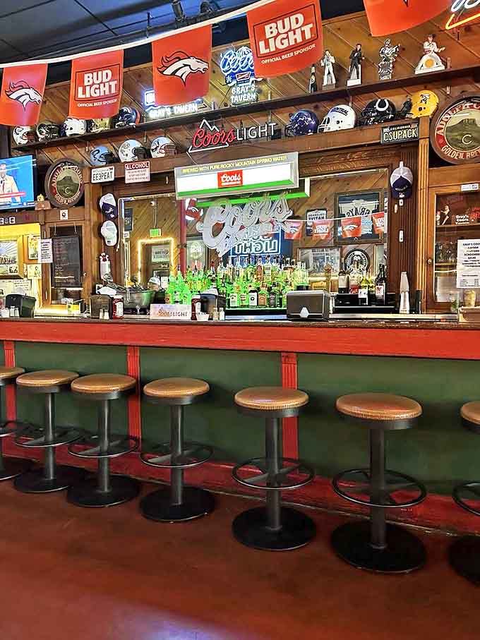 The bar stretches before you like a shrine to cold beer, football helmets, and unapologetic good times forever.