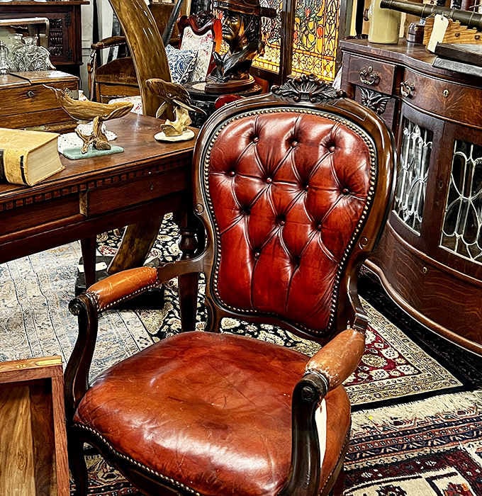 This tufted leather chair isn't just waiting for a new owner&mdash;it's auditioning for the role of "most distinguished piece" in your living room.