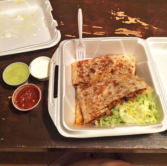 A quesadilla that means business &ndash; perfectly grilled tortilla packed with fillings and served with the trio of sauces that completes the experience.