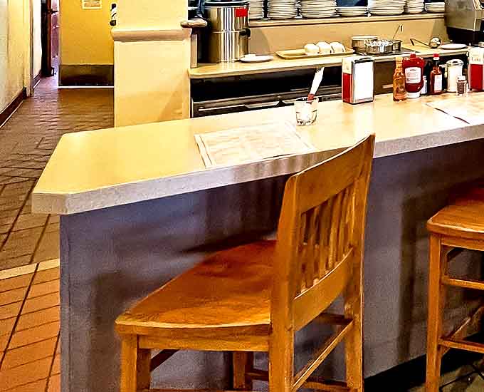 The counter seating offers front-row tickets to the breakfast ballet &ndash; where short-order cooking becomes performance art worth applauding.