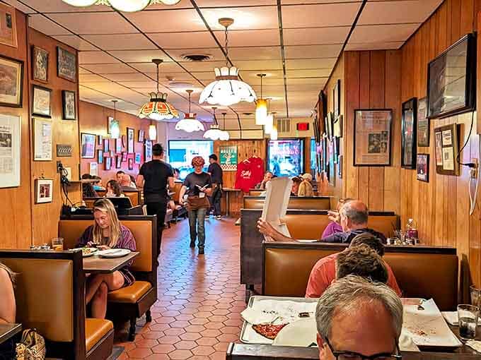 Not just a dining room but a museum of pizza pilgrimage, where every booth has witnessed decades of "first bite" face journeys.