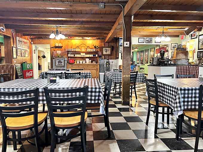 The checkerboard floor and wooden beams create a symphony of nostalgia – like walking into a Norman Rockwell painting that serves breakfast.