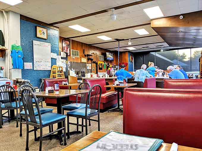 Wood paneling and red booths create that perfect lived-in quality no amount of modern restaurant design could ever replicate.