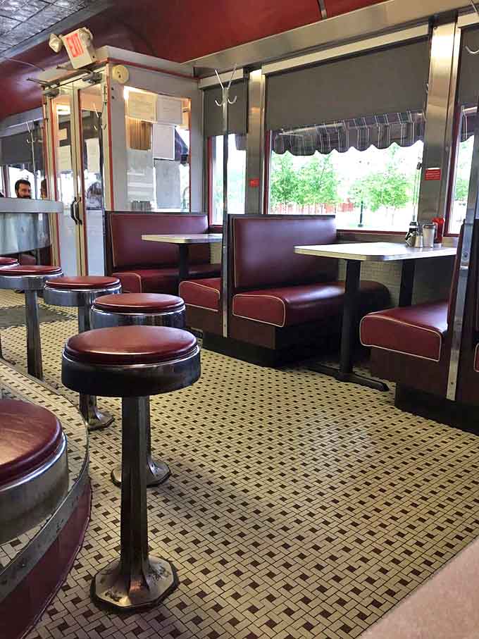 Classic diner booths – where countless first dates, family breakfasts, and life-changing conversations have unfolded over bottomless cups of coffee.