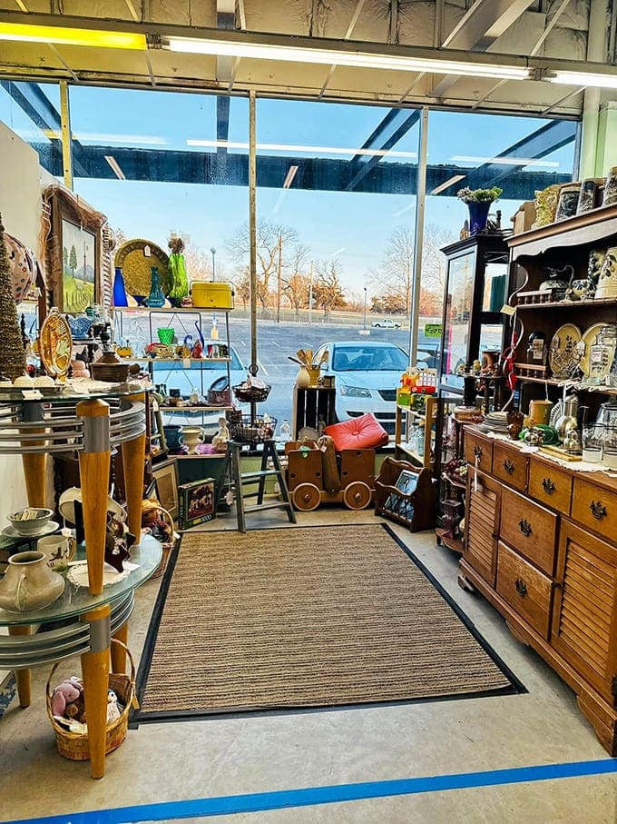 Natural light floods this vendor's corner, illuminating treasures arranged with the care of someone who understands that presentation is everything.