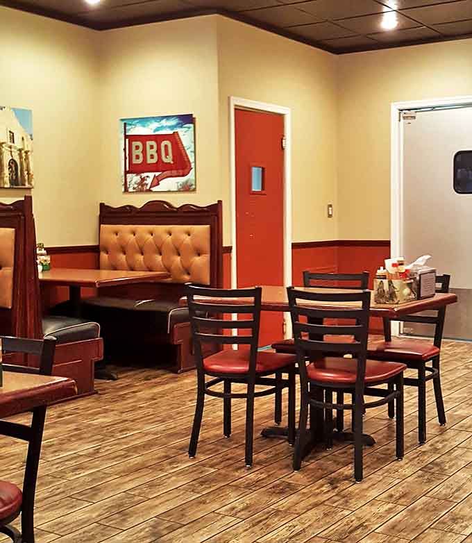 Red accents and wooden booths create that "where everybody knows your name" vibe, minus the Boston accent.