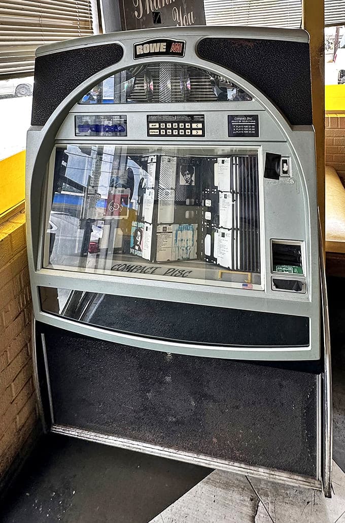 The jukebox stands sentinel, guardian of decades of musical memories, waiting for quarters and indecision about which classic deserves playing next.