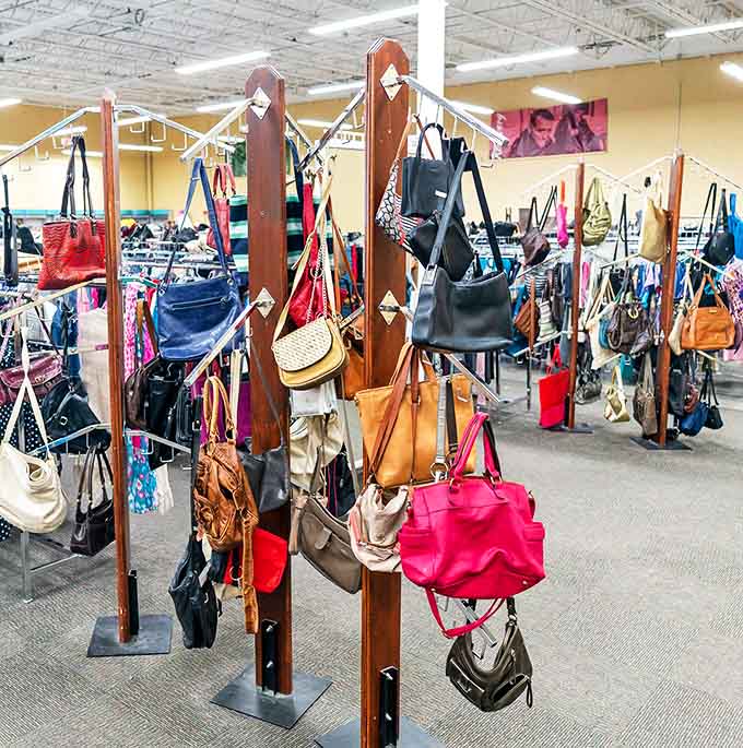 Handbag heaven! These pre-loved purses hang like colorful fruit, ripe for the picking and ready for their second act.