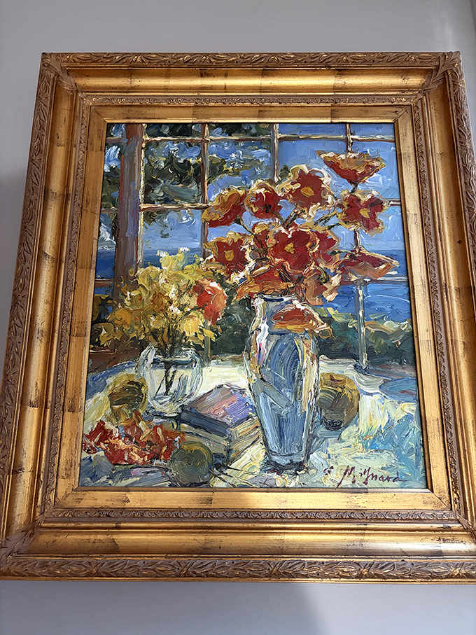 Impressionist flowers captured in oils and gilt frame. Someone's window view from decades ago becomes your wall's new conversation piece.