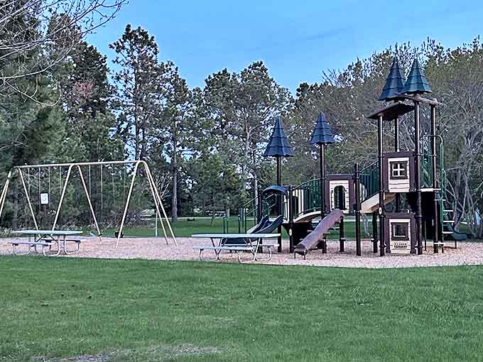As dusk approaches, the playground's castle silhouette stands ready for tomorrow's imaginative conquests and legendary slides.