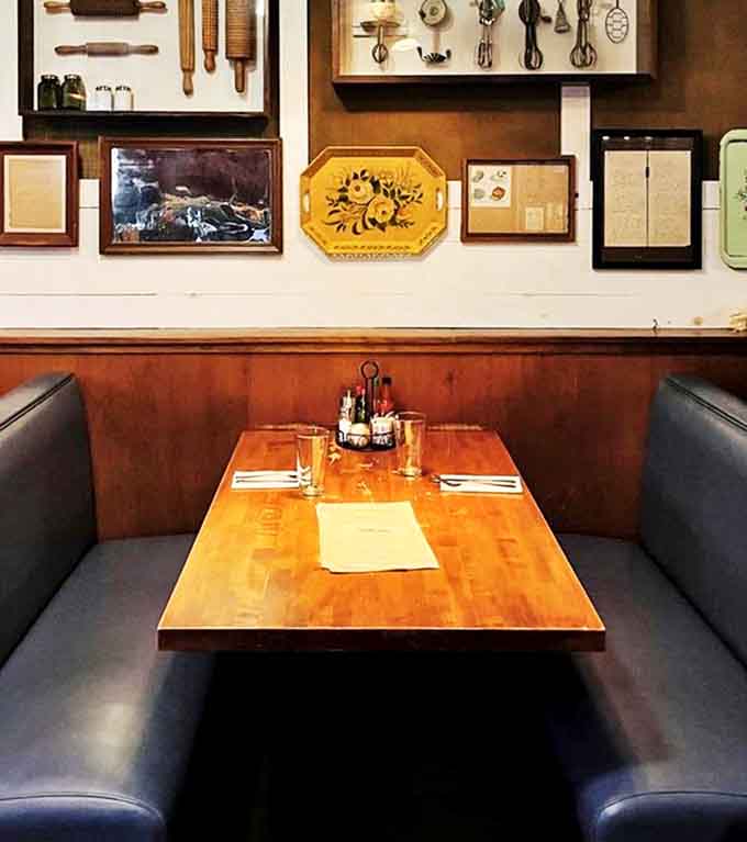 Vintage kitchen tools adorn the walls, silently supervising your enthusiastic consumption of Southern delicacies.