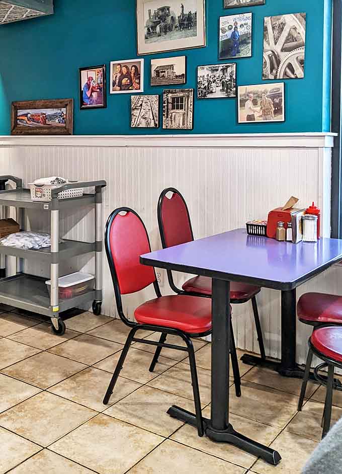 The corner table where local stories are exchanged like currency and the blue walls showcase memories that predate social media.