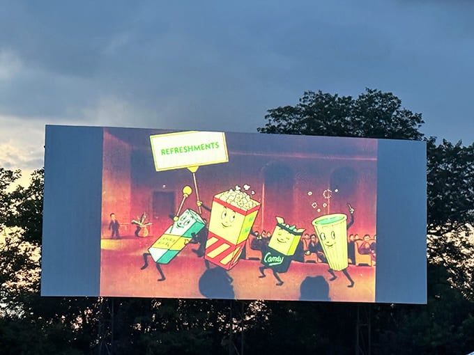 The dancing concession characters on screen remind us that intermission isn't just a break&mdash;it's part of the show at this nostalgic playground.