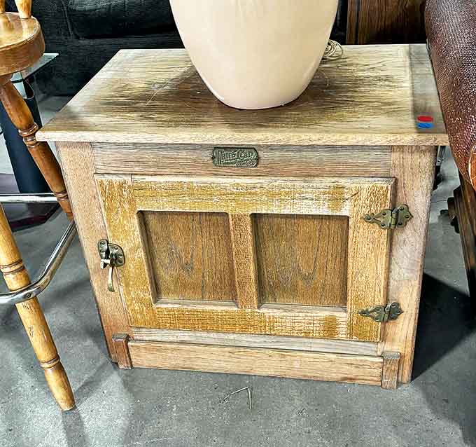This vintage wooden cabinet whispers tales of farmhouse kitchens past. Solid craftsmanship that's outlived several smartphone generations.