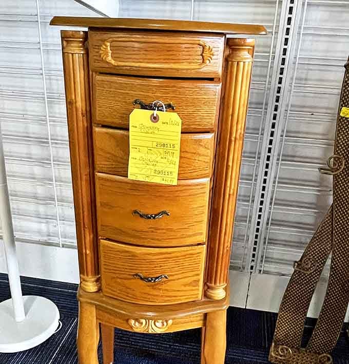 This elegant wooden jewelry cabinet whispers of heirloom quality. Solid craftsmanship that would cost ten times more new sits patiently for its next owner.