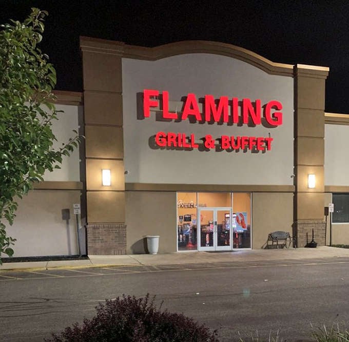 Flaming Grill's illuminated sign cuts through the night like a beacon for the hungry. When those red letters glow, your stomach knows!