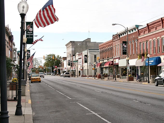 American flags flutter along Kendallville's Broadway, where yesterday's grandeur meets today's small-town charm.