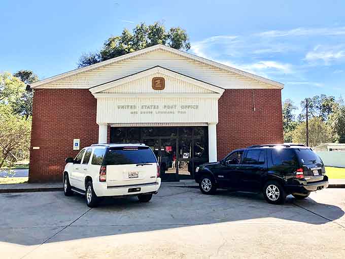 Mer Rouge's post office stands like a dignified elder statesman. Where stamps come with a side of local gossip!