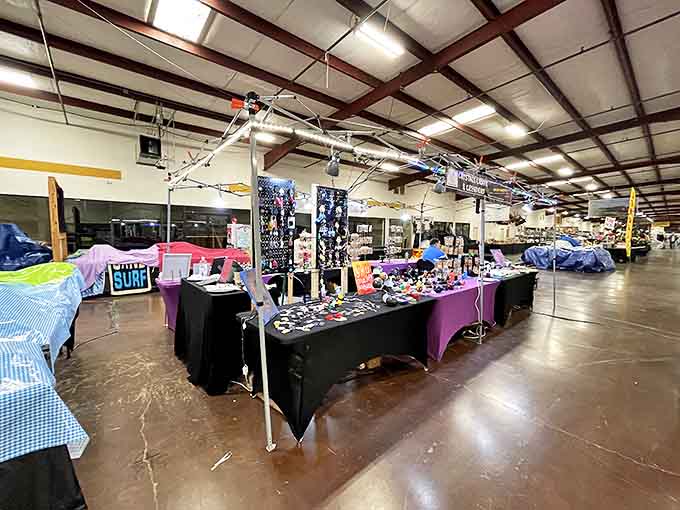 Tupelo Flea Market's organized chaos spreads across a massive indoor space where every table promises new possibilities.
