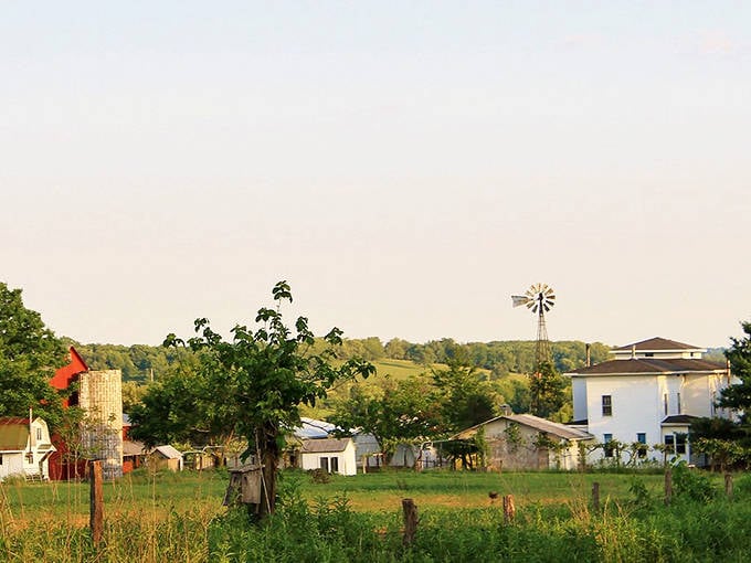 White farmhouses nestle among rolling fields, creating scenes that Norman Rockwell would have loved to capture.