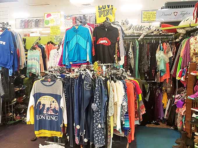 Racks of colorful clothing tell silent stories of decades past, from vintage band tees to sequined party wear.