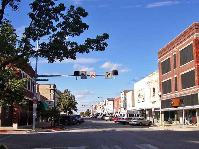 Tree-lined streets and historic architecture create a perfect small-town atmosphere in downtown Kirksville's bustling business district area.