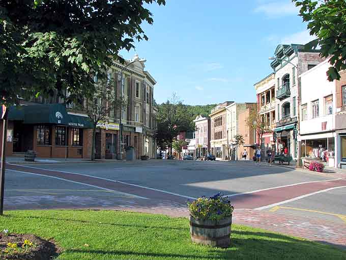 Downtown Saranac Lake on a sunny day – historic storefronts line the quiet street and create the perfect small-town symphony.