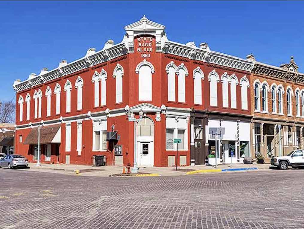 The vibrant storefronts of Red Cloud offer a colorful contrast to Nebraska's famous big sky country.