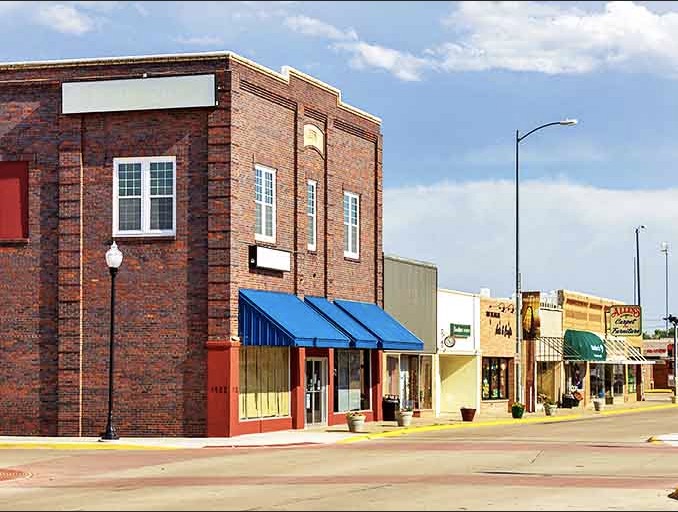 Ogallala's main street showcases colorful storefronts where local businesses thrive in buildings with genuine character.