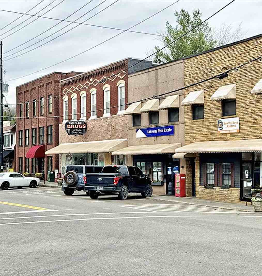 These weathered brick facades have witnessed decades of small-town life, standing strong like reliable old neighbors.