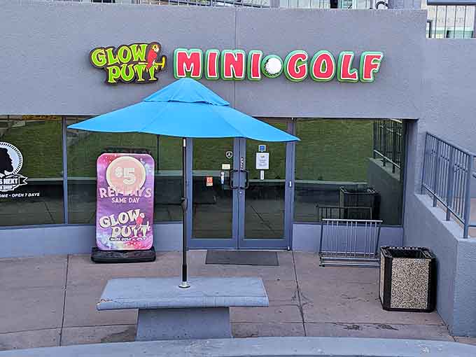 Bright neon signs welcome you to a fun-filled glow-in-the-dark mini golf experience for all ages.