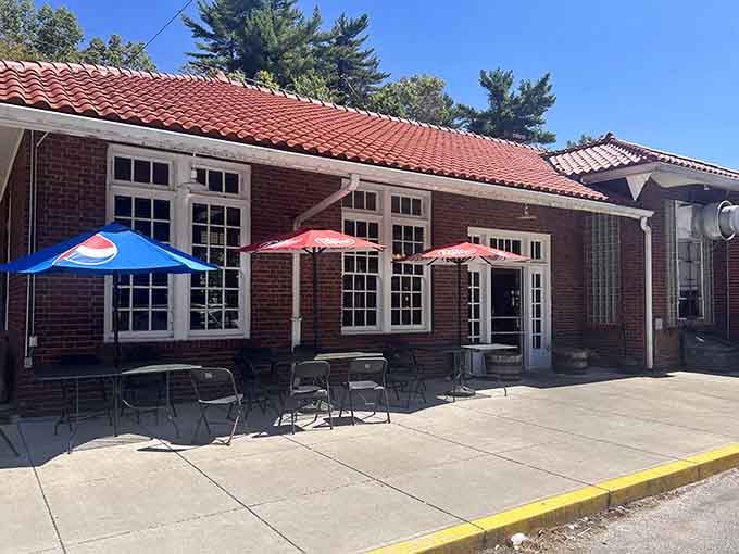 That red tile roof and classic brick facade aren't just for show—this is where history meets hickory smoke.