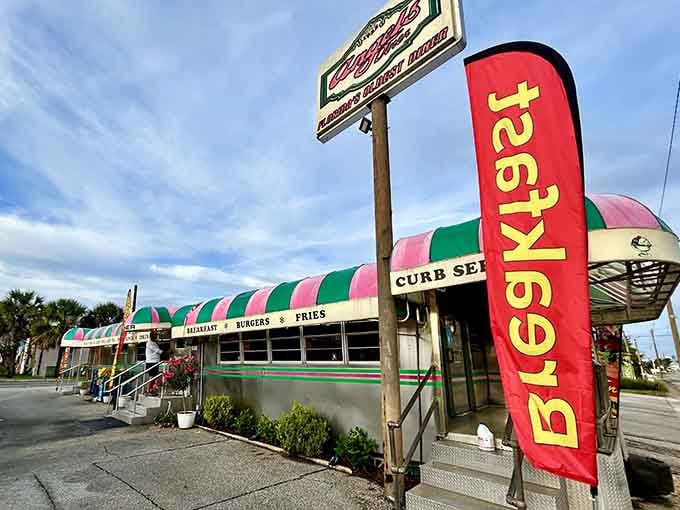 That turquoise and pink striped awning isn't just decoration; it's a beacon calling you home to 1950s America.