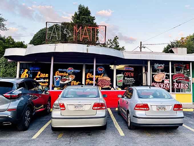 That neon sign isn't just advertising; it's a beacon calling barbecue lovers home to smoky salvation.
